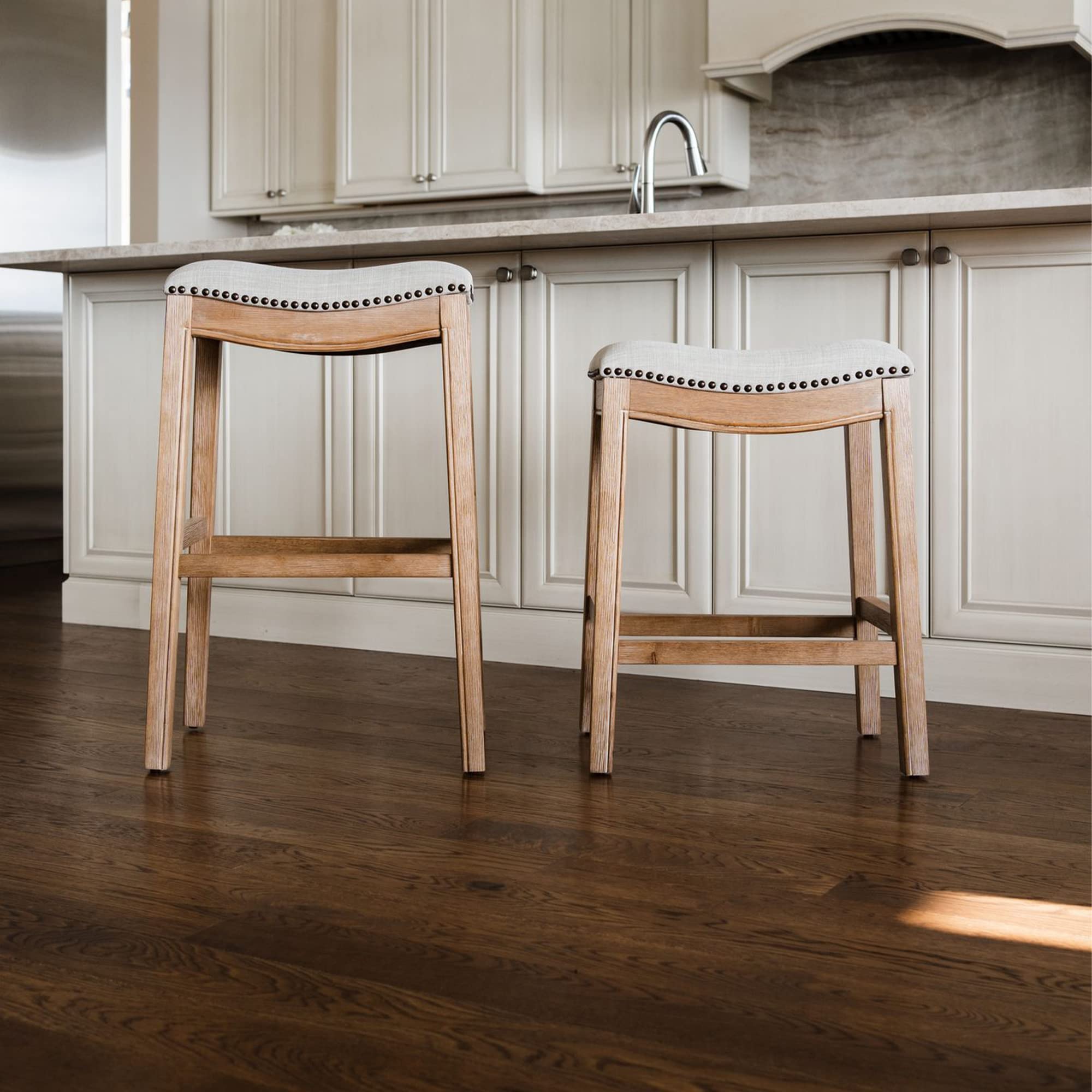 Maven Lane Adrien 31 Inch Bar Height Upholstered Backless Saddle Barstool in Weathered Oak Finish with Sand Color Fabric Cushion Seat, Set of 4