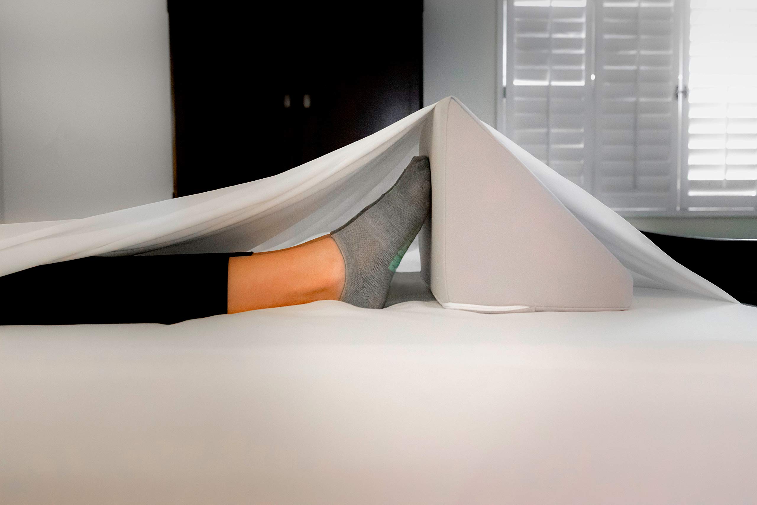 Bed Block Foot & Leg Elongation Pillow for Better Sleep | Elevation Support Foam Wedge Lifts The Sheets Around Your Feet | Increases Airflow While Removing Pressure 16 x 9.5 x 8.5 in Gray