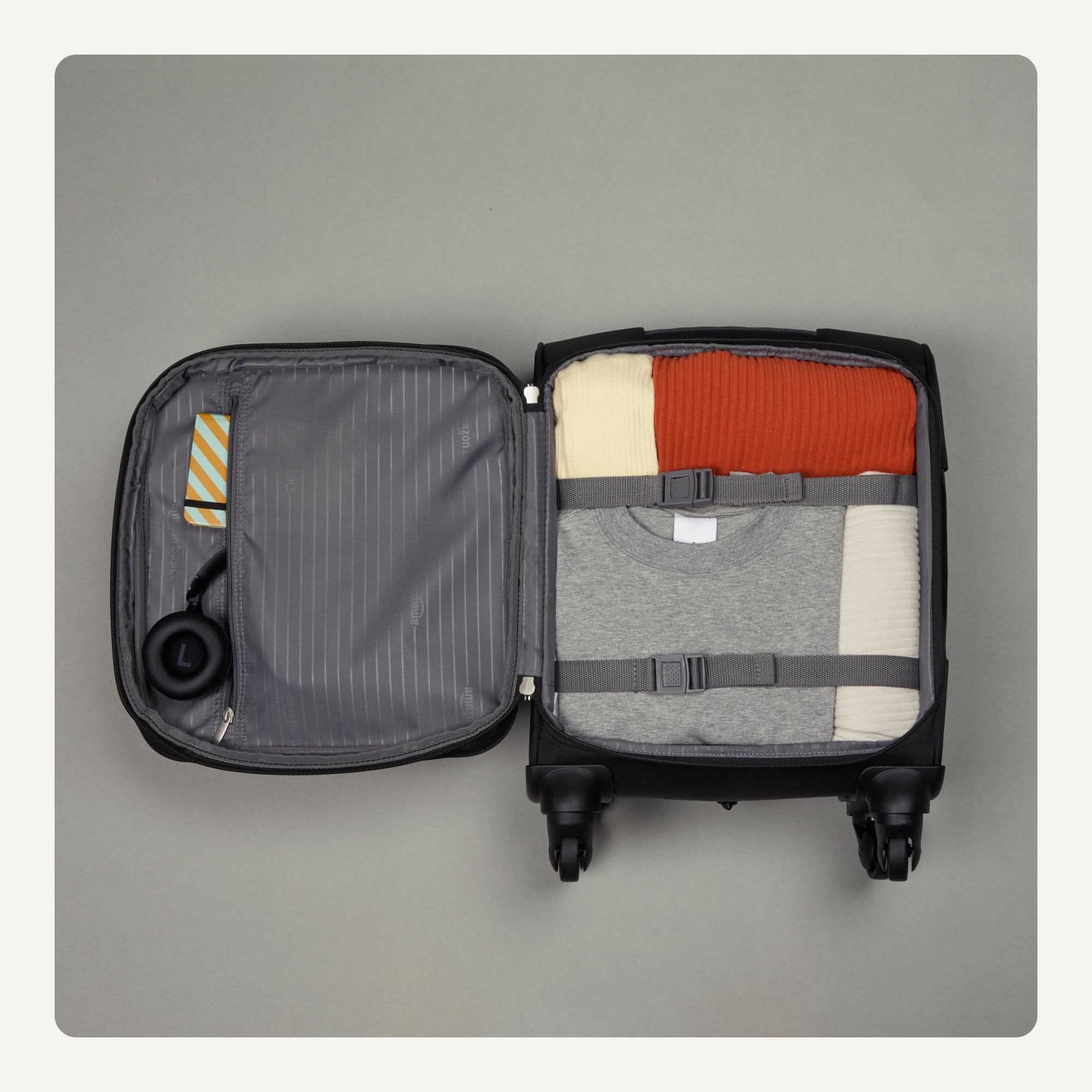 Amazon Basics Luggage, 18" Small Carry-On Softside Suitcase With Wheels, With Four 360-Degree Multi-directional Spinner Wheels, Expandable Space, Zippered Pocket and Straps, Telescopic Handle, Black