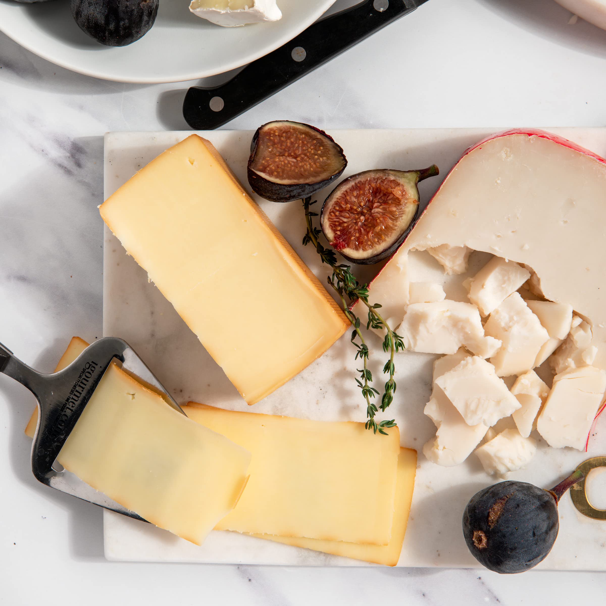 igourmet Cheese Sampler - Our Royal 8-Cheese Assortment contains Blue Cheese, Goat Cheese, Nutty, Smoked, Tangy, Spanish Cheese, Goat Cheese, Creamy, and Swiss