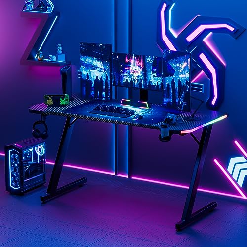Kemon Gaming Desk with LED Lights, Z Shaped PC Gaming Table Computer Desk Ergonomic Home Office Desks, Carbon Fibre Surface Gamer Workstation with Mouse Pad, Cup Holder and Headphone Hook (63 inch)