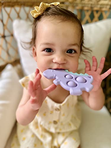 Itzy Ritzy Sensory Popper Toy for Babies - Itzy Pop Toy Features Raised Textures to Soothe Sore Gums, Relieve Stress & Improve Motor Skills - Baby & Toddler Fidget Toy for 3 Mo. & Up (Purple Dinosaur)