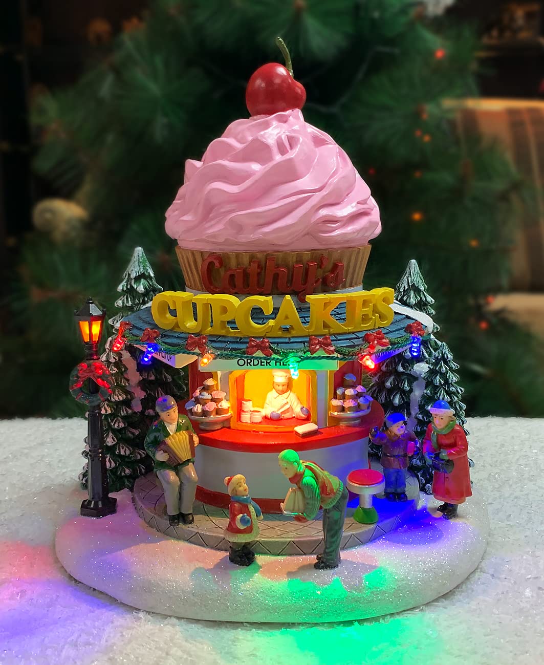MOMENTS IN TIME Christmas Village Building, Cupcake Shop with LED Lights and Christmas Music - Battery Operated (not Included) (10.4" H x 9.5" W x 7.5" D)