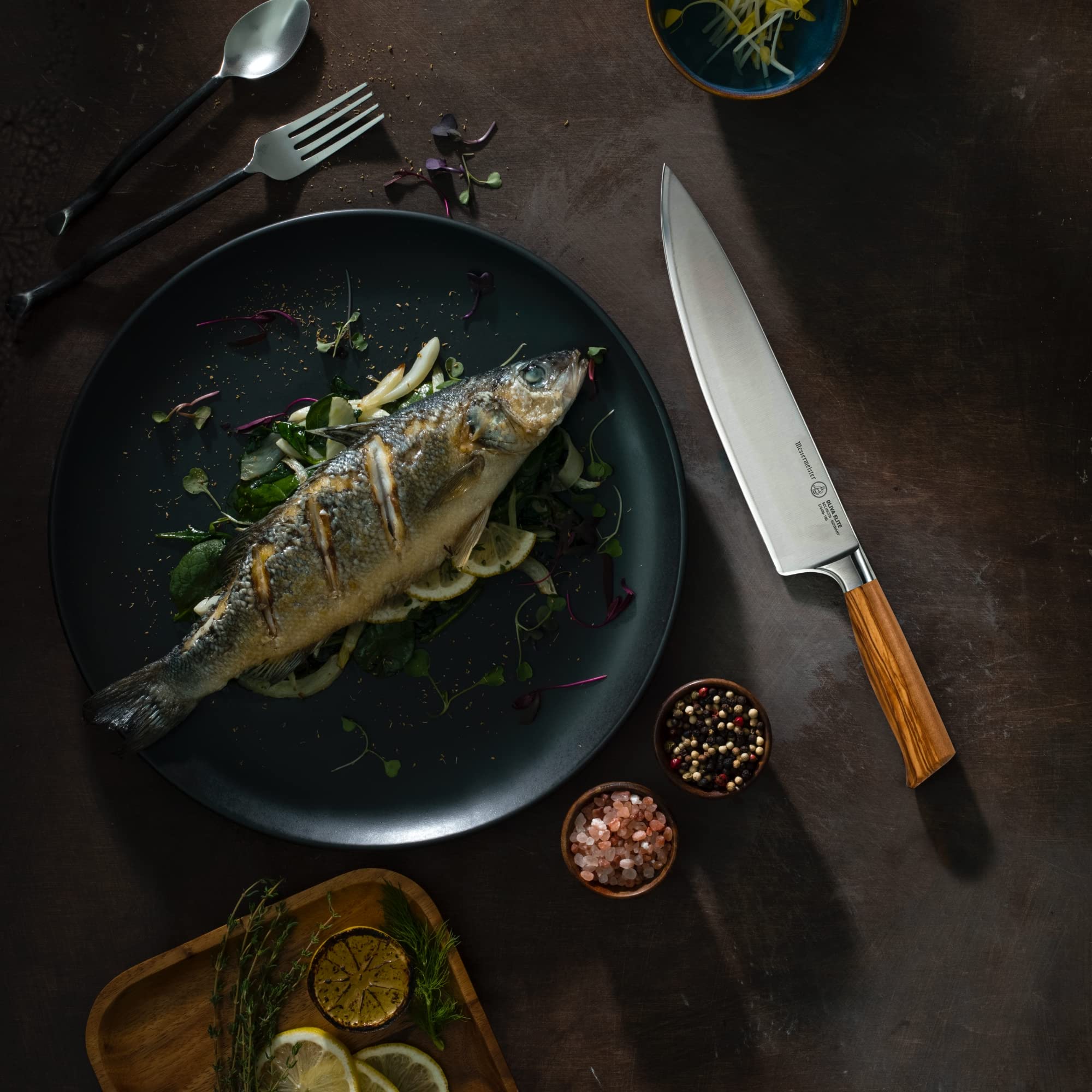 Messermeister Oliva Elite Stealth 10” Chef’s Knife - Fine German Steel Alloy Blade & Natural Mediterranean Olive Wood Handle - Rust Resistant & Easy to Maintain