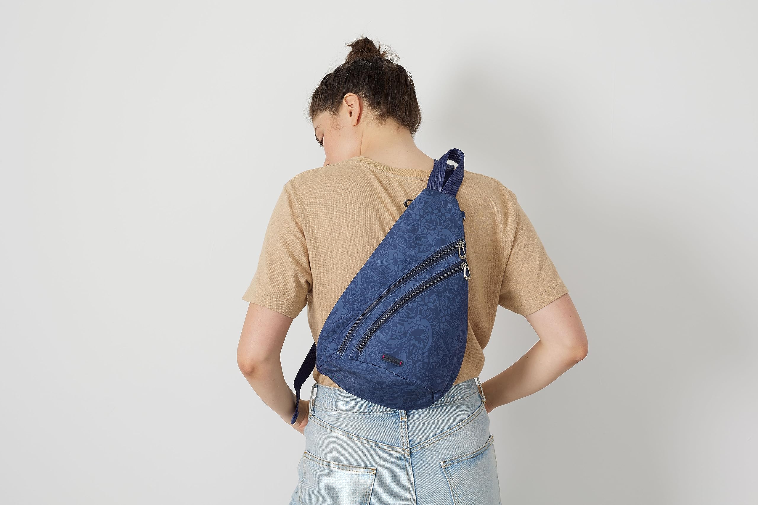 Sakroots On The Go Sling Backpack in Eco Twill, Adjustable Sling Strap, Aubergine