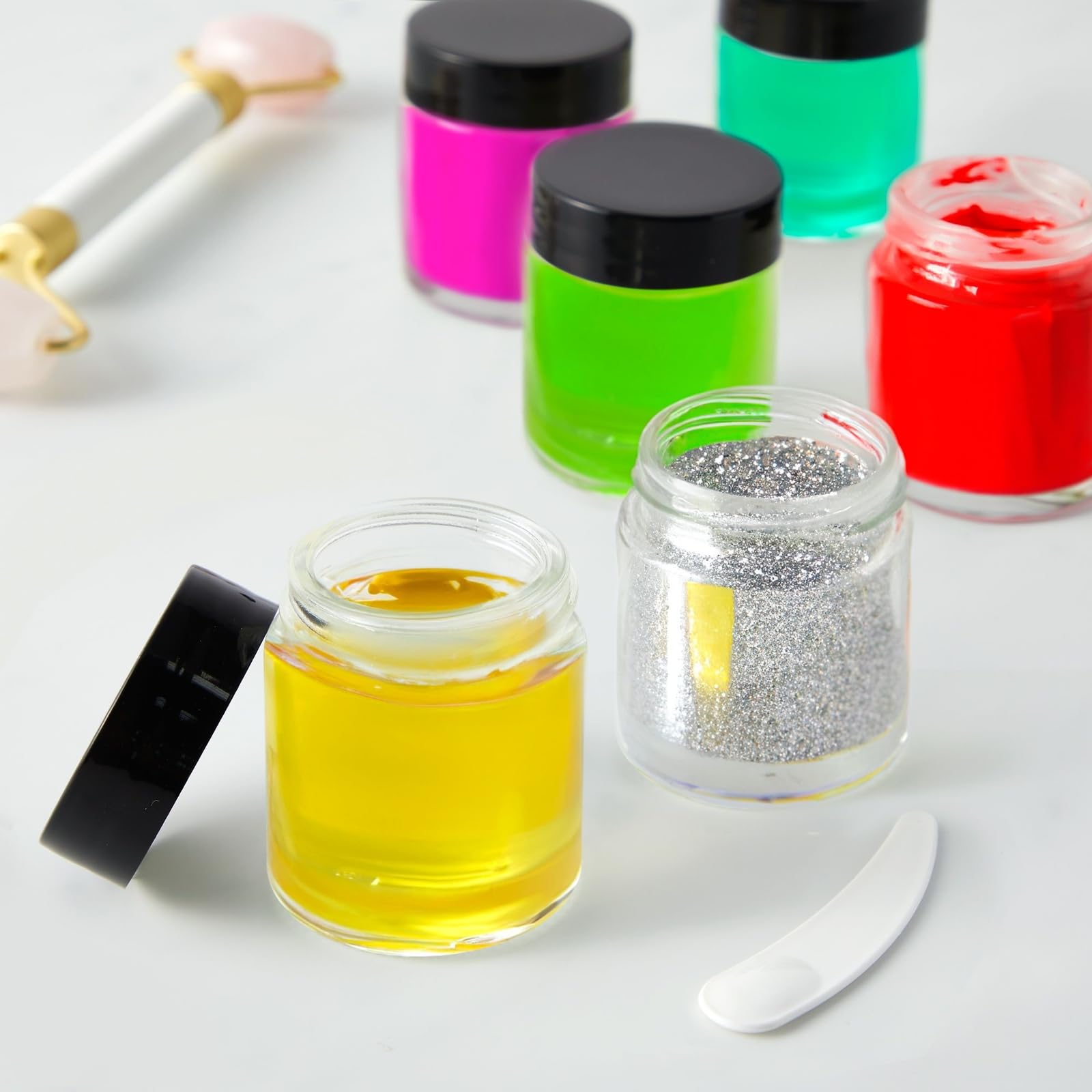 Juvale 24 Pack Small Glass Containers with Lids 1 oz, Empty Jars with 6 Spatulas for Creams, Cosmetics, DIY Ointments, Mixing (30ml)