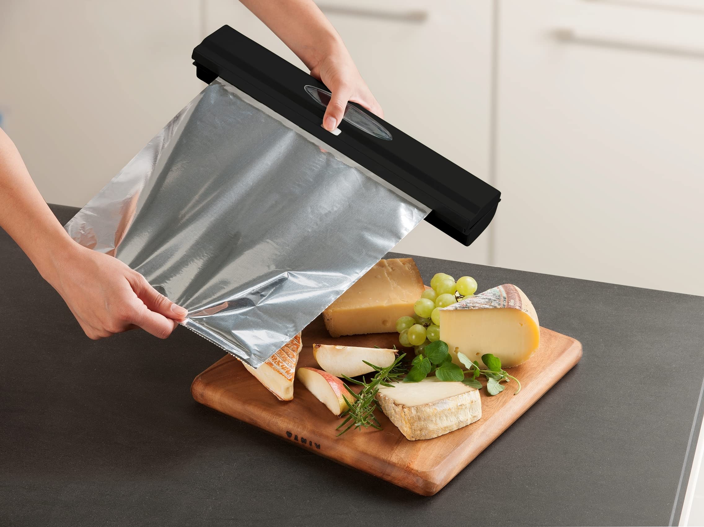 WENKO Plastic, Cling Film Holder, Refillable Aluminum Foil Wrap Dispenser with Slide Cutter for Kitchen Organization, 14.96 x 2.05 x 2.64 in, Black