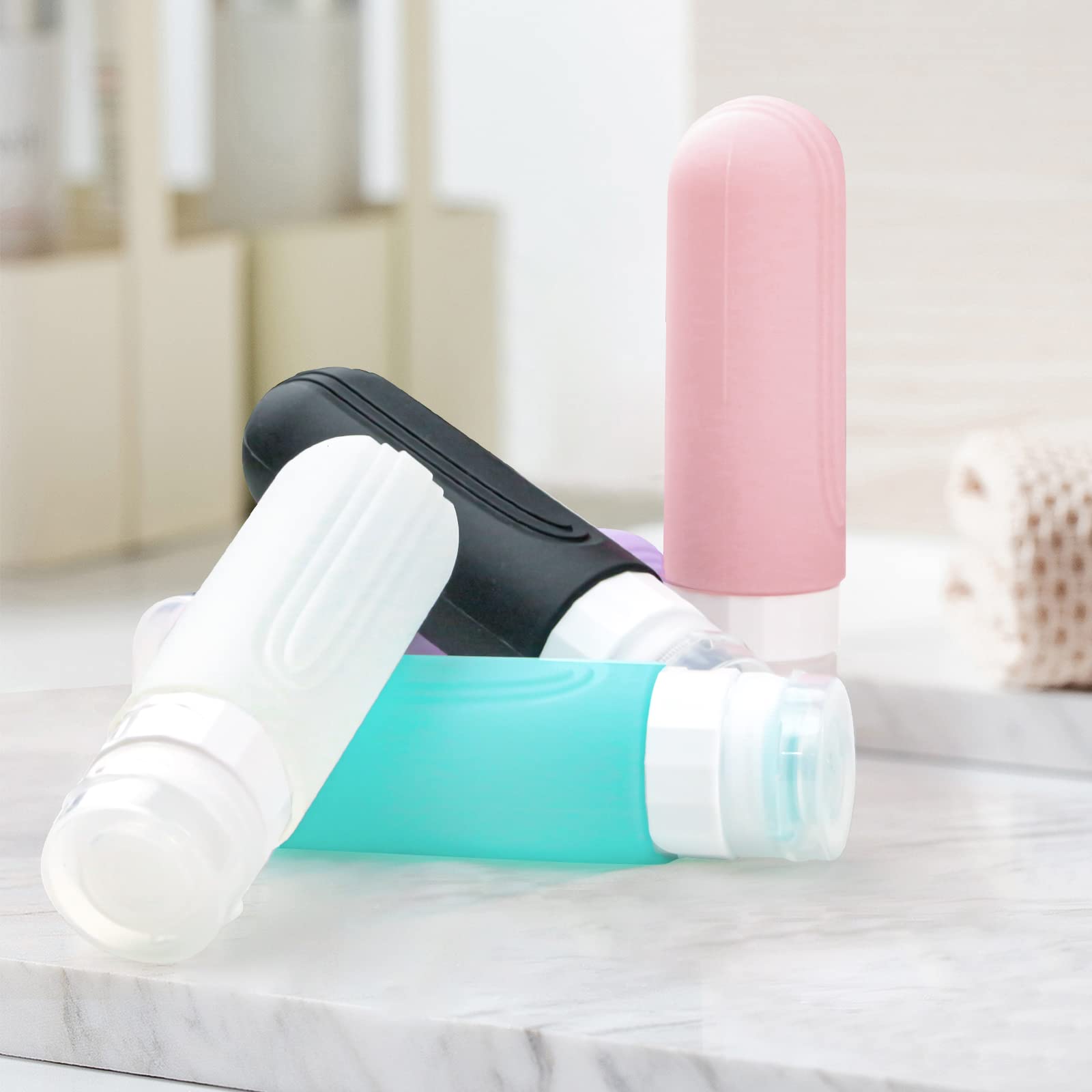 Xerhnan Leakproof Silicone Travel Bottles Carry On Refillable Portable Liquid Containers for Shampoo, Conditioner, Lotion, Toiletries (4PCS,Rose,Purple,Blue,Pink)