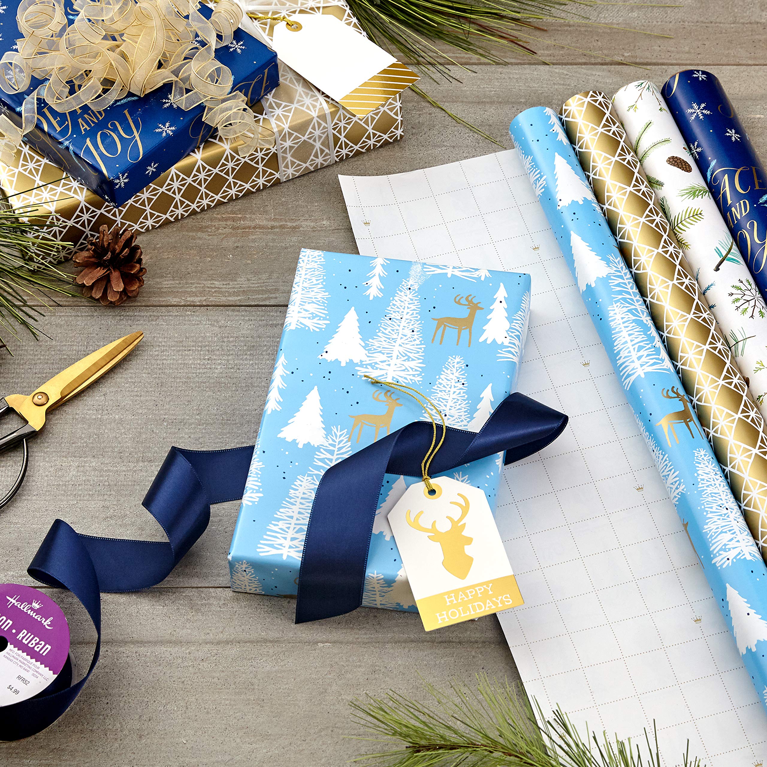 Hallmark Holiday Wrapping Paper Bundle with Cut Lines on Reverse, Quirky Christmas (Pack of 4, 120 sq. ft. ttl) Yeti, Santa, Penguin, Snowflakes, Blue, Gold