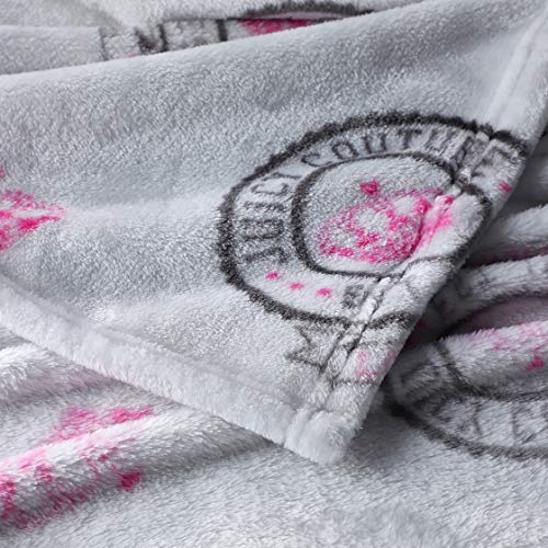 Juicy Couture – Throw Blanket | Juicy Emblem | Plush and Cozy | Decorative Blankets for Sofas, Chairs and Beds| Luxurious and Soft | Chic Home Décor | Measures 50” x 70” | Pink/Black/White