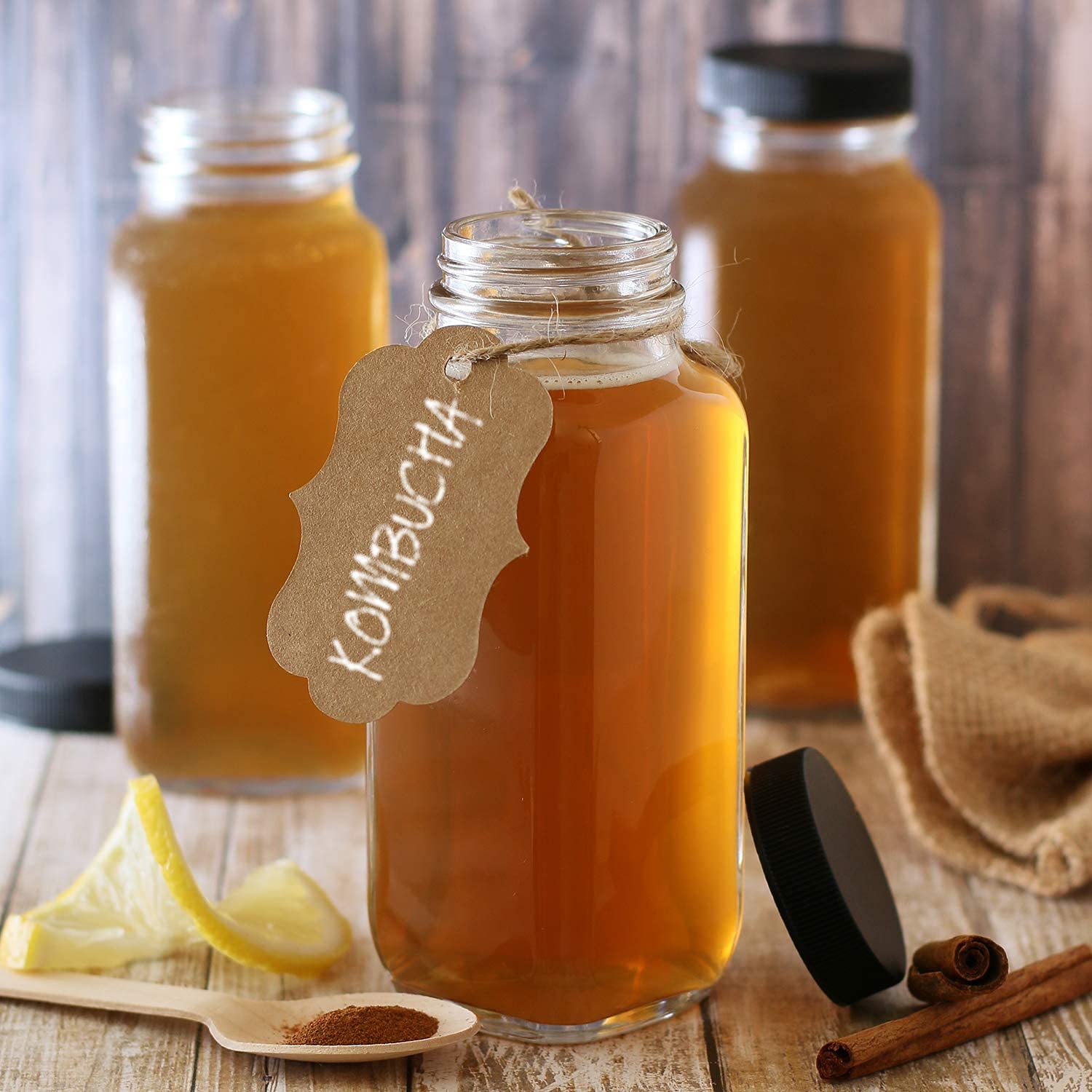 DilaBee Glass Juice Bottles with Lids - 12 Pack - Reusable Glass Water Bottles with Caps for Juicing, Smoothie, Milk and Kombucha - Homemade Drinking Bottles - 8 Oz