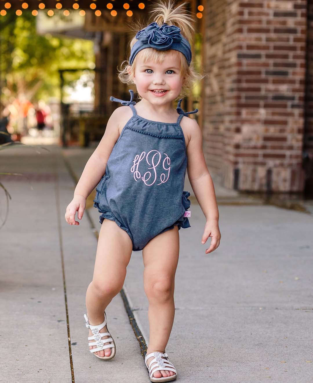 RuffleButts® Baby/Toddler Girls Faux Denim Pom Pom Bubble Romper - 3-6m