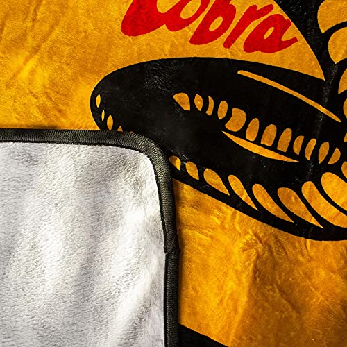 Surreal Entertainment Cobra Kai Strike First Oversized Plush Throw Blanket | Cozy Sherpa Cover For Sofa, Bed Super Soft Fleece Official Karate Kid Collectible 45 x 60 Inches, Yellow, One Size