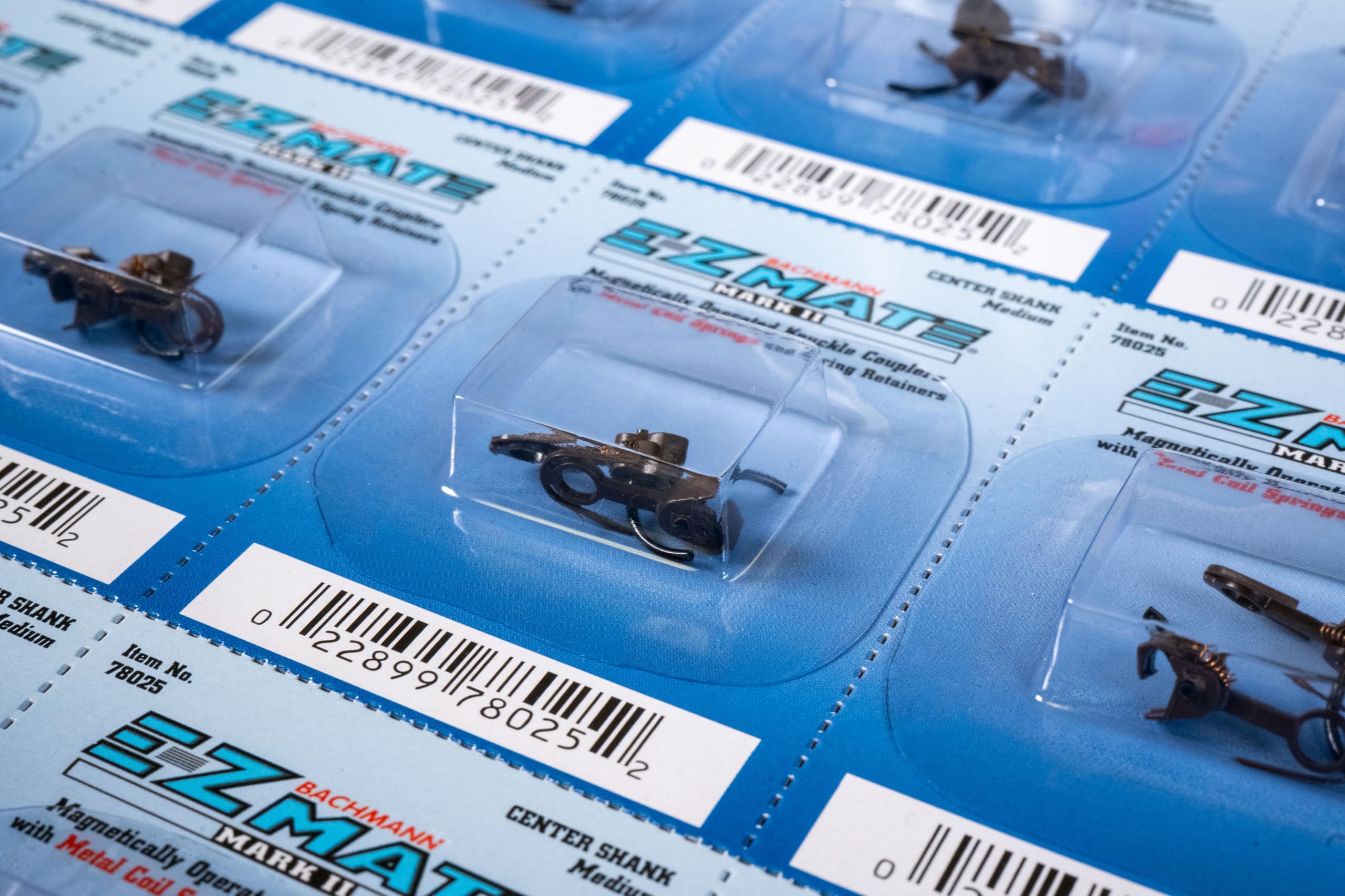 Bachmann Trains - E-Z MATE MARK II COUPLERS - MAGNETIC KNUCKLE COUPLERS with METAL COIL SPRING - CENTER SHANK - MEDIUM (12 pair/card) - HO Scale