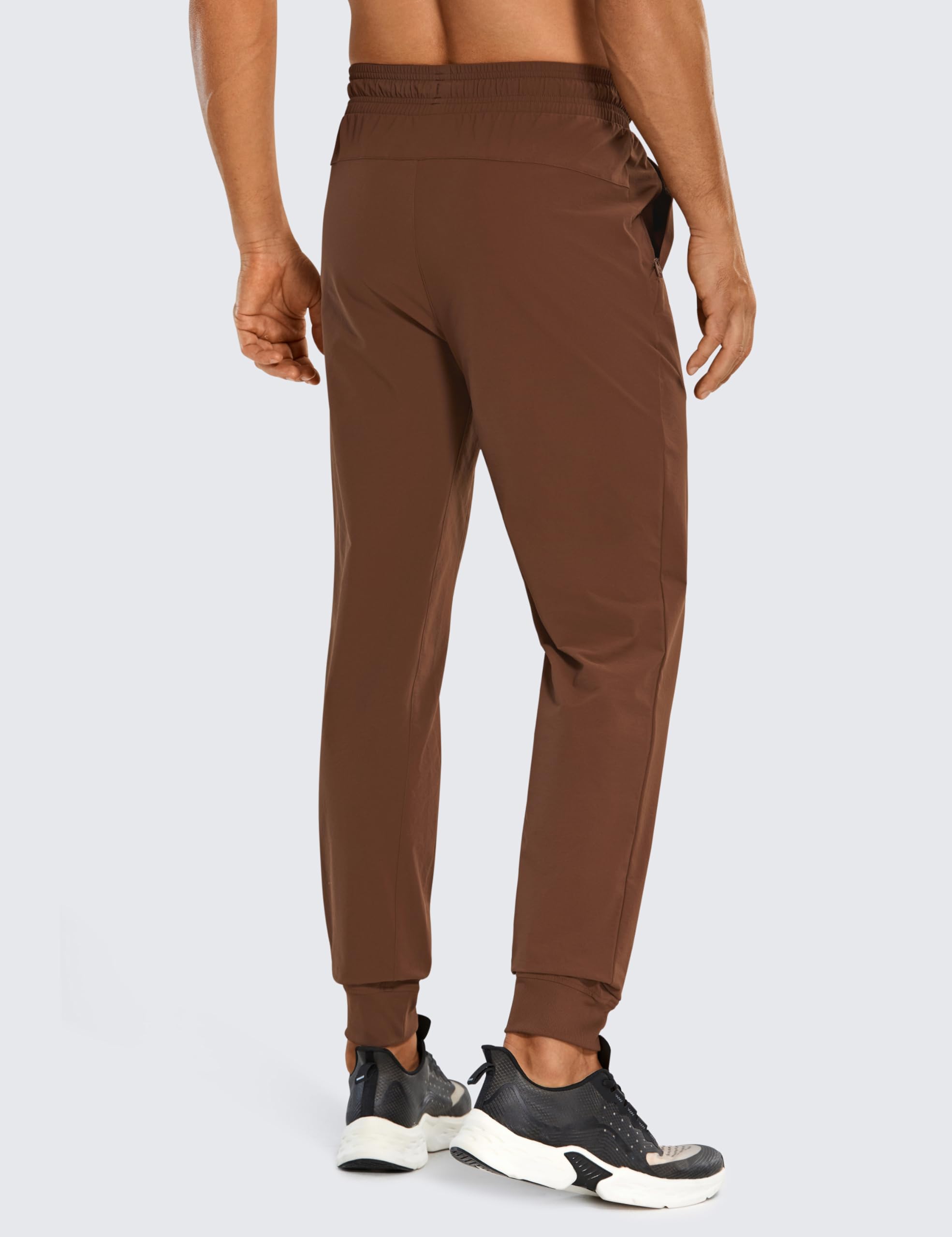CRZ YOGA Athletic Joggers for Men 29" Lightweight Water Resistant Outdoor Workout Pants with Zip Pockets Dark Brown Large