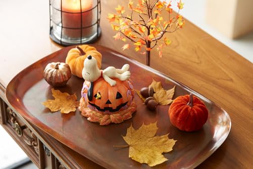 Enesco Peanuts by Jim Shore Halloween Snoopy Laying on Carved Pumpkin Figurine, 5.5 Inch, Multicolor