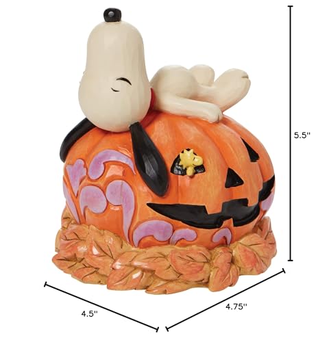 Enesco Peanuts by Jim Shore Halloween Snoopy Laying on Carved Pumpkin Figurine, 5.5 Inch, Multicolor