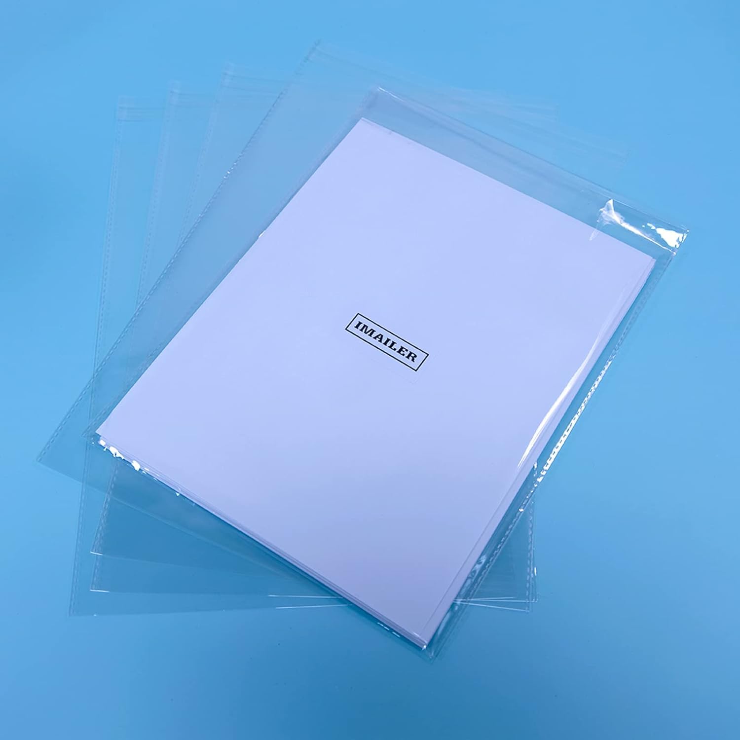 iMailer - 100 Count - 9" x 12" Cellophane Bags Self Adhesive - Clear Cello Resealable Plastic Poly Bags for A4, Letter Sized Documents, Plastic Sleeves, Clothing