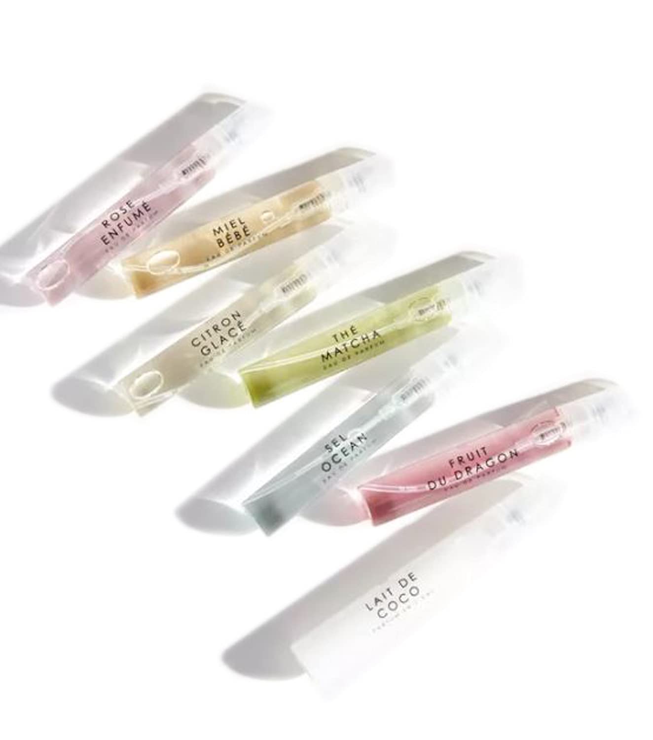 Gourmand Eau De Parfum Le Jet Set! 7 Scents Citron Glace, Fruit du Dragon, Lait de Coco, Miel Bebe, Rose Enfume, Sel Ocean & Matcha! Assorted Mini Fragrance Spray Gift Set! Vegan and cruelty Free!