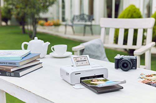 Canon SELPHY CP1300 Wireless Compact Photo Printer (White) RP-108 Color Ink Paper Set (108 Sheets of 4 x 6 Paper) + NeeGo Printer Cable + NeeGo Print Protector (100 Pack)