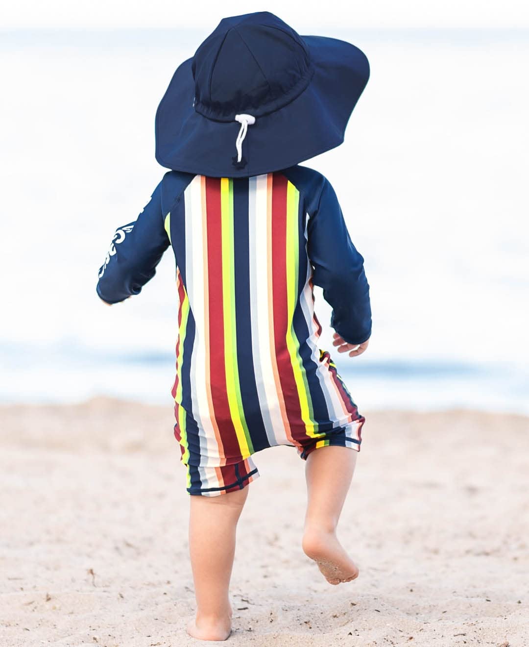 RUGGEDBUTTS Baby/Toddler Boy Swimsuit, One Piece Zipper Rash Guard Sunsuit with UPF 50+ Sun Protection - Sunset Stripe - 12-18m