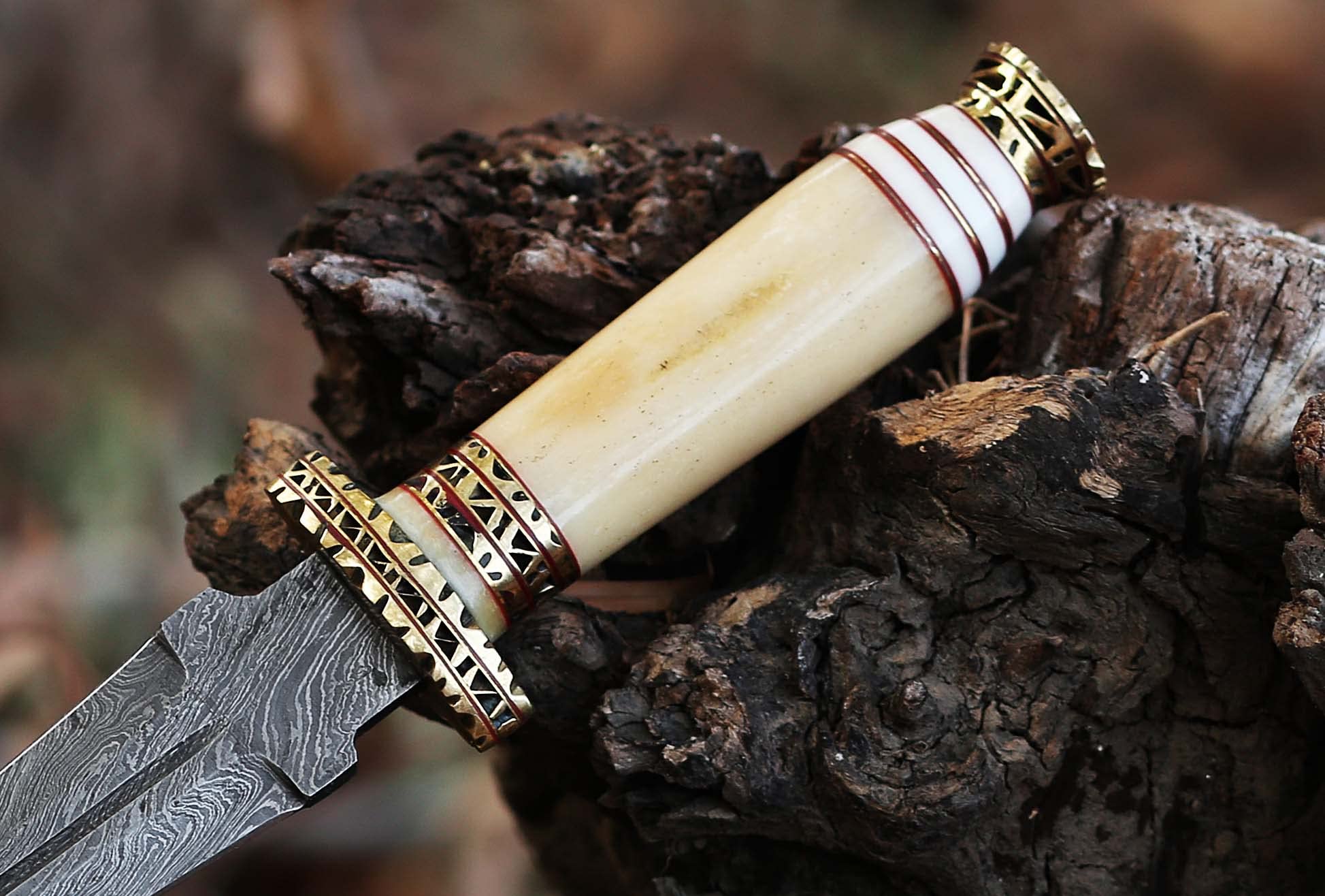 12.5 Inch long Hunting knife, Collectible knife, Natural Camel bone scale embellished with engraved brass finger guard, foil work spacer and pommel, Hand forged Twist pattern Damascus steel blade, Comes with Leather sheath