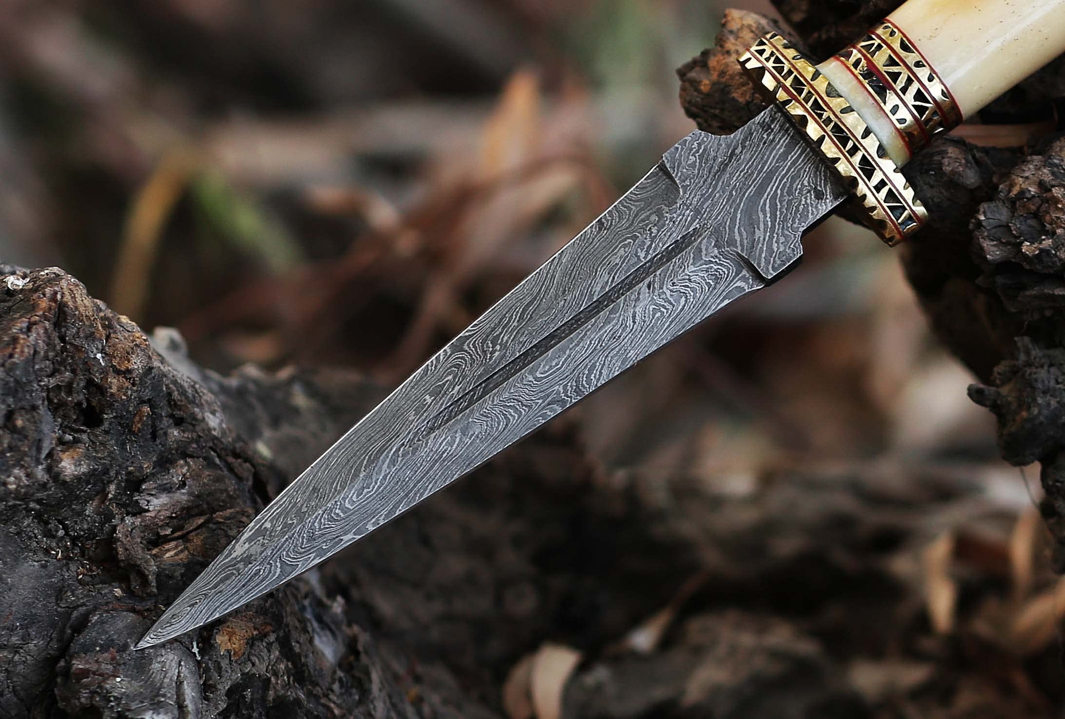 12.5 Inch long Hunting knife, Collectible knife, Natural Camel bone scale embellished with engraved brass finger guard, foil work spacer and pommel, Hand forged Twist pattern Damascus steel blade, Comes with Leather sheath