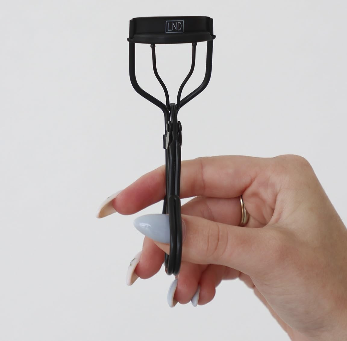 Lash Next Door Professional Eyelash Curler - Instant Long Lasting Curl, Lifts & Shapes - No Pinching or Creasing. Includes Replacement Pad (in Black)