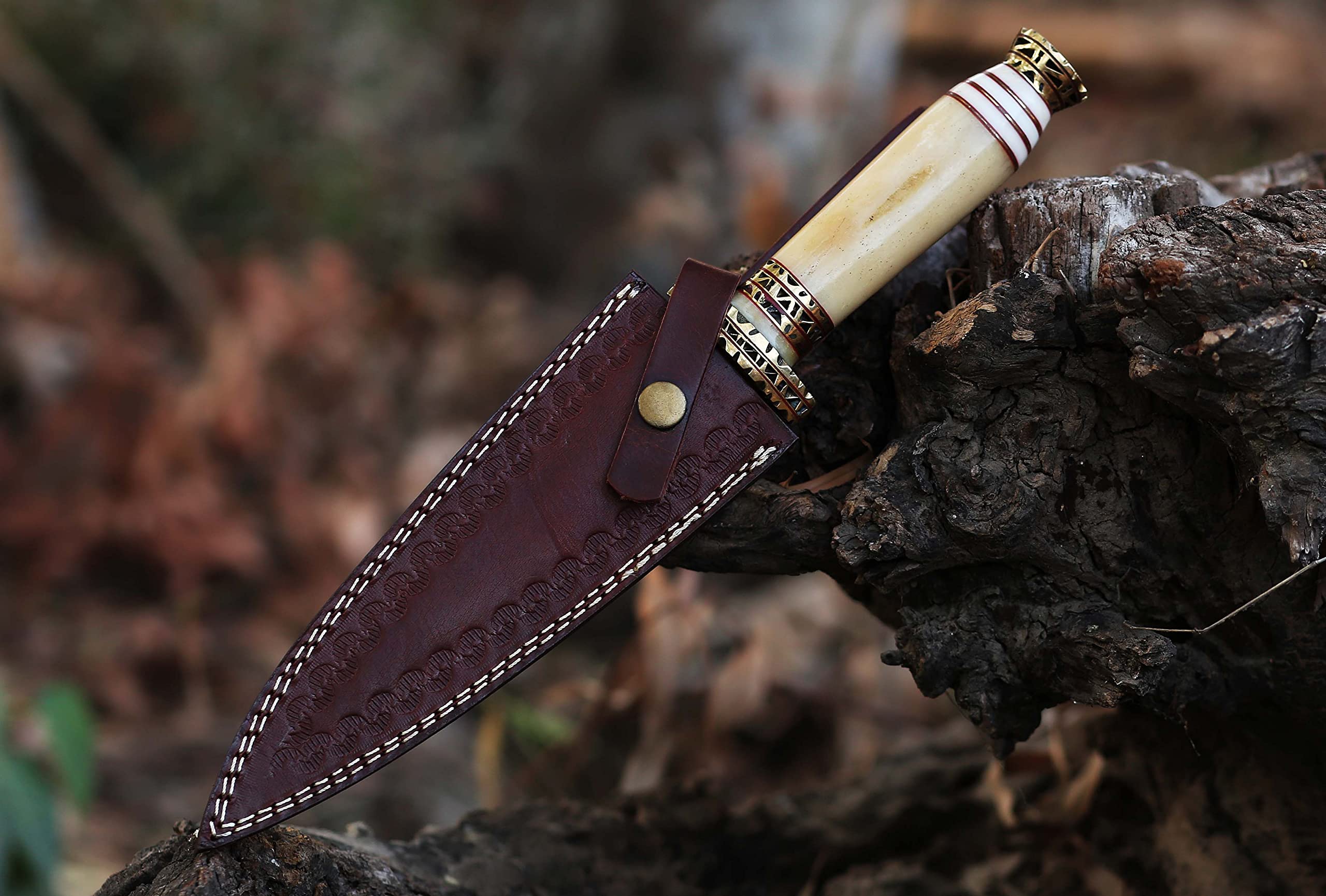 12.5 Inch long Hunting knife, Collectible knife, Natural Camel bone scale embellished with engraved brass finger guard, foil work spacer and pommel, Hand forged Twist pattern Damascus steel blade, Comes with Leather sheath