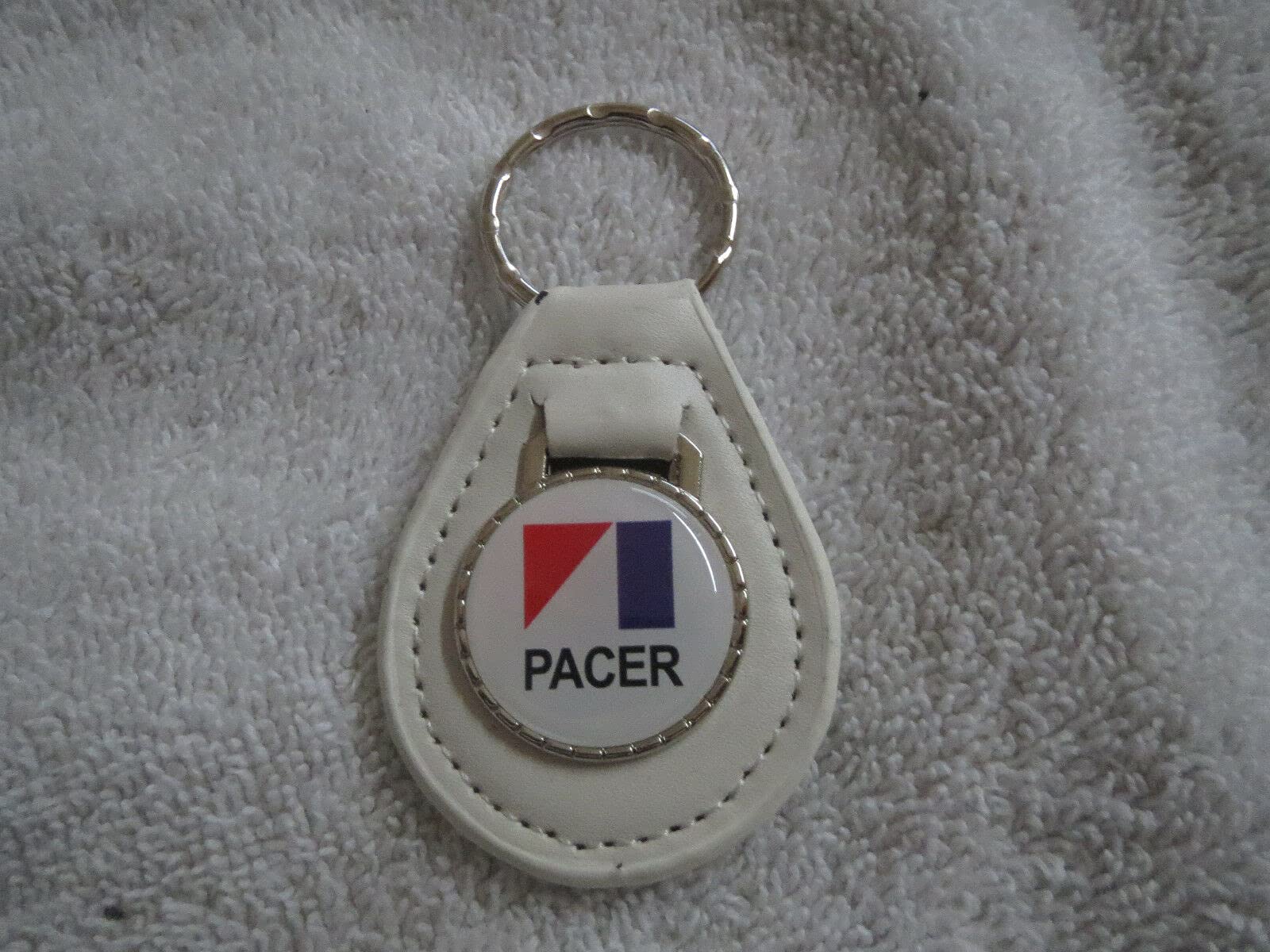 1975 1976 1977 1978 1979 AMC PACER LOGO EMBLEM LEATHER KEYCHAIN - WHITE