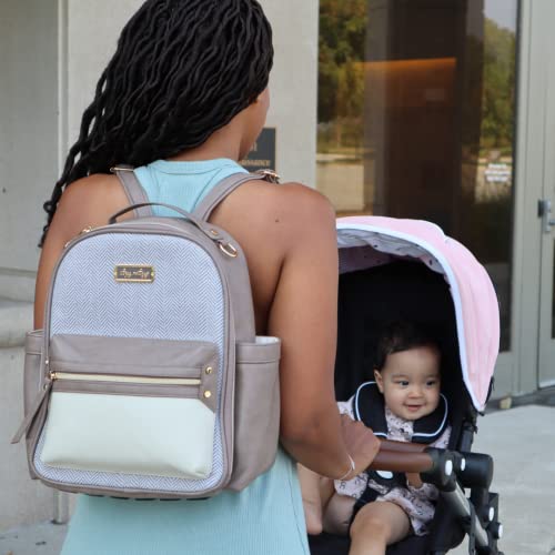 Itzy Ritzy Mini Diaper Bag Backpack β Chic Mini Diaper Bag with Changing Pad, 8 Total Pockets (4 Internal and 4 External), Grab-Top Handle and Rubber Feet (Vanilla Latte)