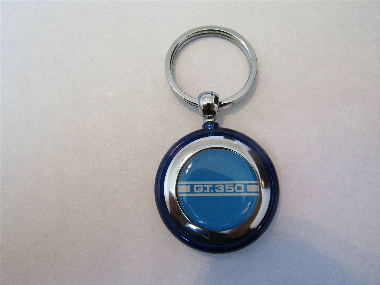 1965 1966 1967 1968 1969 1970 SHELBY GT-350 WHITE STRIPE ON BLUE ROUND PLASTIC KEYCHAIN - BLUE