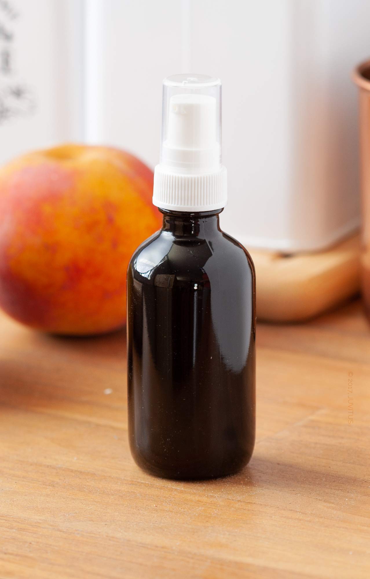 JUVITUS 2 oz Black Glass Luxury Boston Round Bottle White Treatment Pump (12 Pack) + Funnel