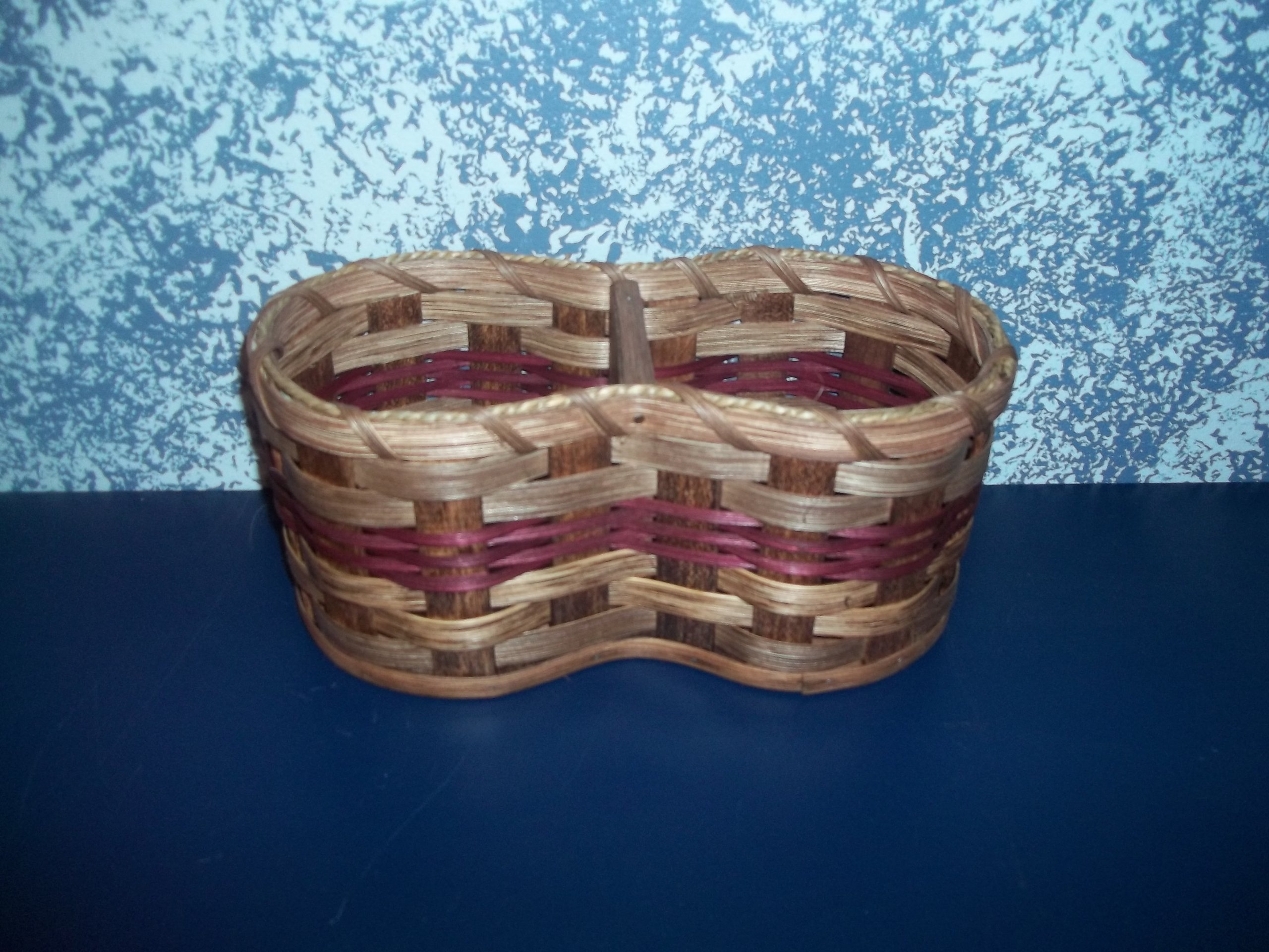Amish Handmade Home and Garden Peanut Basket. This Handmade Basket Was Designed to Put Nuts in One Side and Empty the Shells in the Other Side. This Basket Is in the Shape of a Peanut and Will Make a Great Conversation Piece. Colors May Vary (Black, Red,