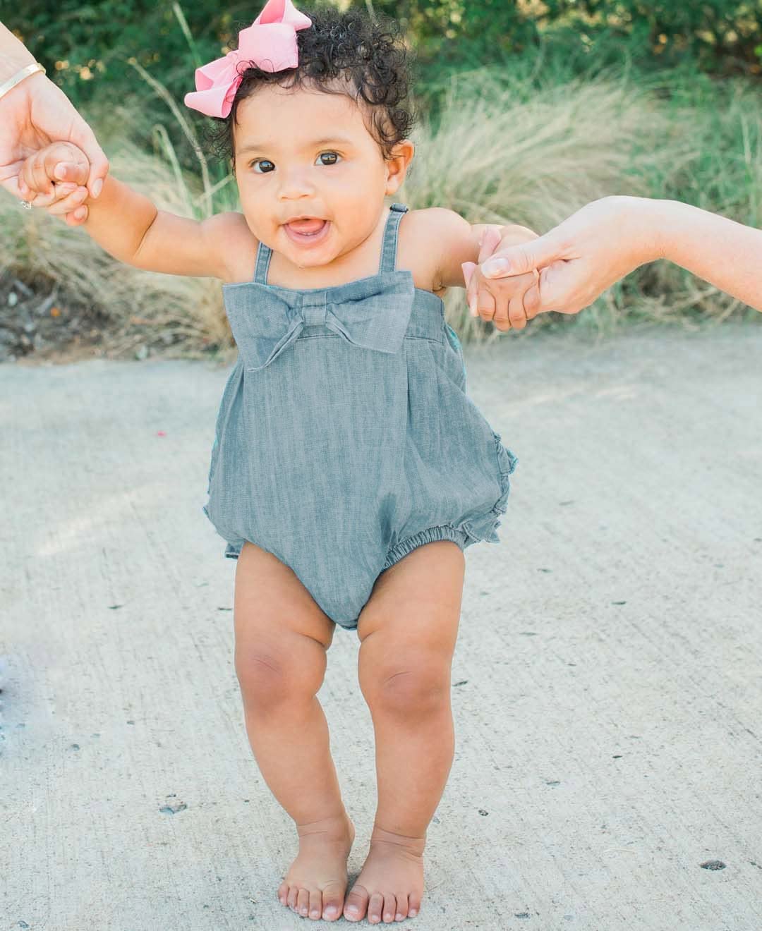 RuffleButts® Baby/Toddler Girls Light Wash Denim Bow-Front Bubble Romper - 3-6m