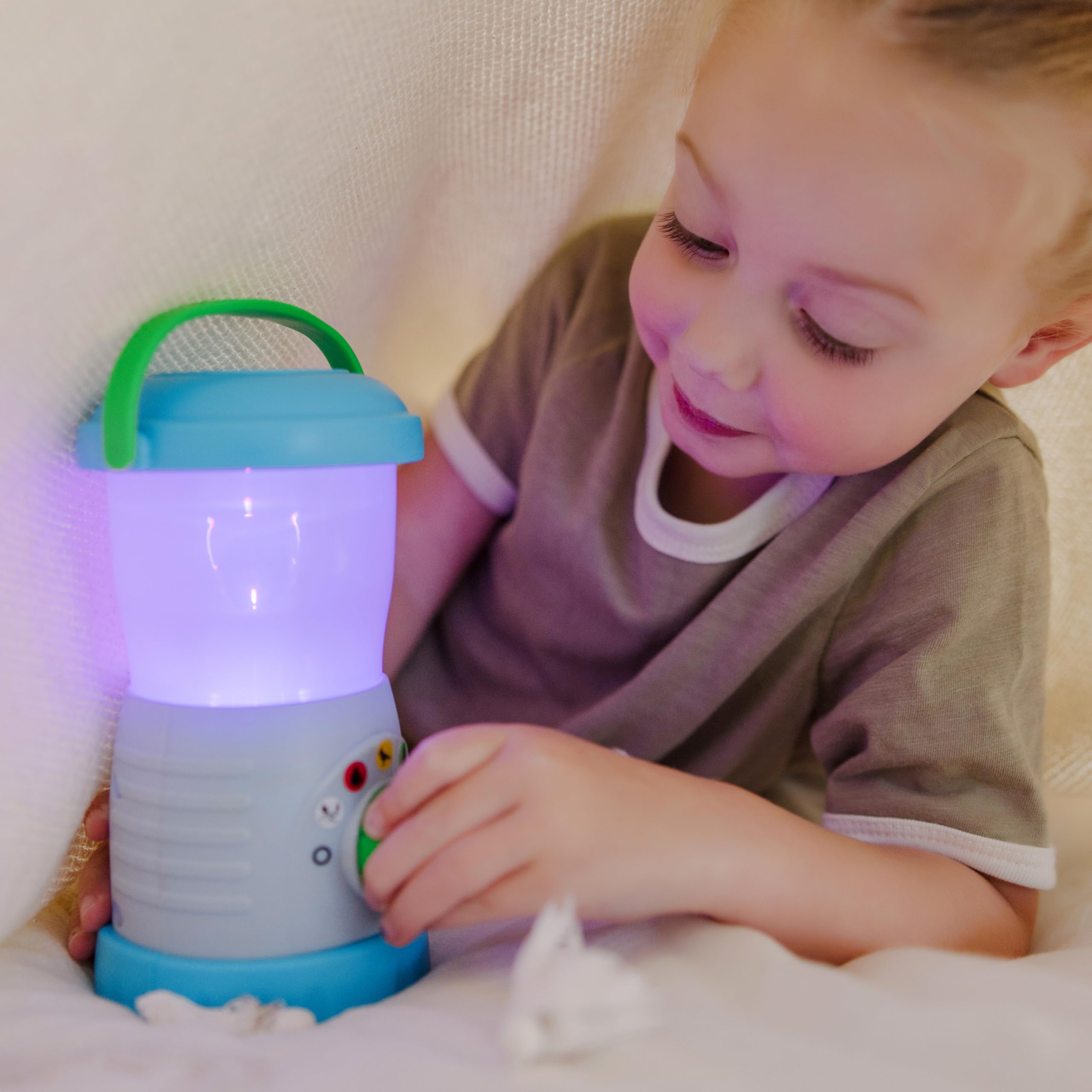 Melissa & Doug Let’s Explore Light & Sound Camping Lantern Play Set, lantern, 3 double-sided cards to set the scene (cards store in bottom of lantern), collectible medallion