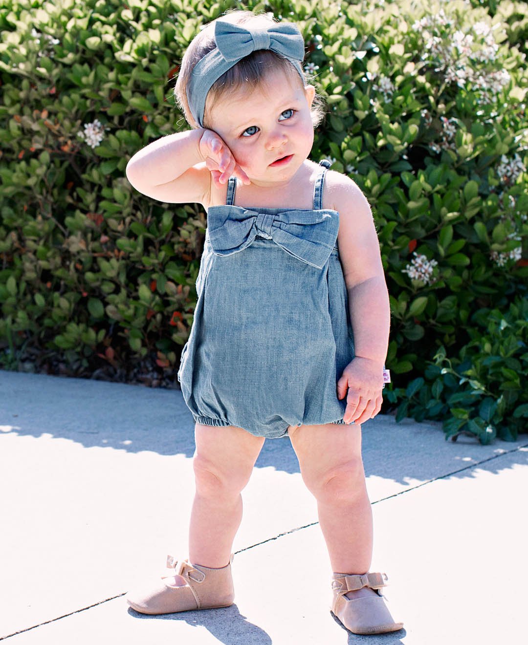 RuffleButts® Baby/Toddler Girls Light Wash Denim Bow-Front Bubble Romper - 3-6m