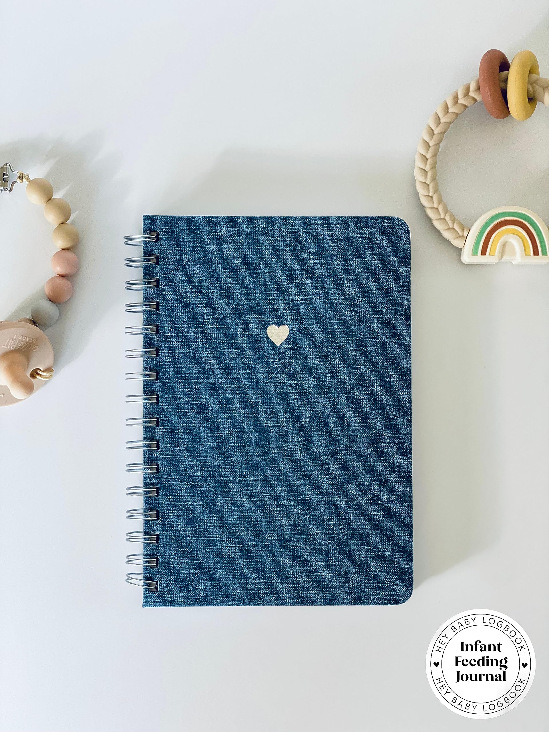 Baby's Daily Logbook, Breastfeeding Journal, Track your Infant’s Feedings, Sleep, and Diaper changes. Plus Bonus Sections including: Growth Charts, Illness Charts, Milestones, Teeth Chart, Doctor appointment notes, and Storage Pocket.