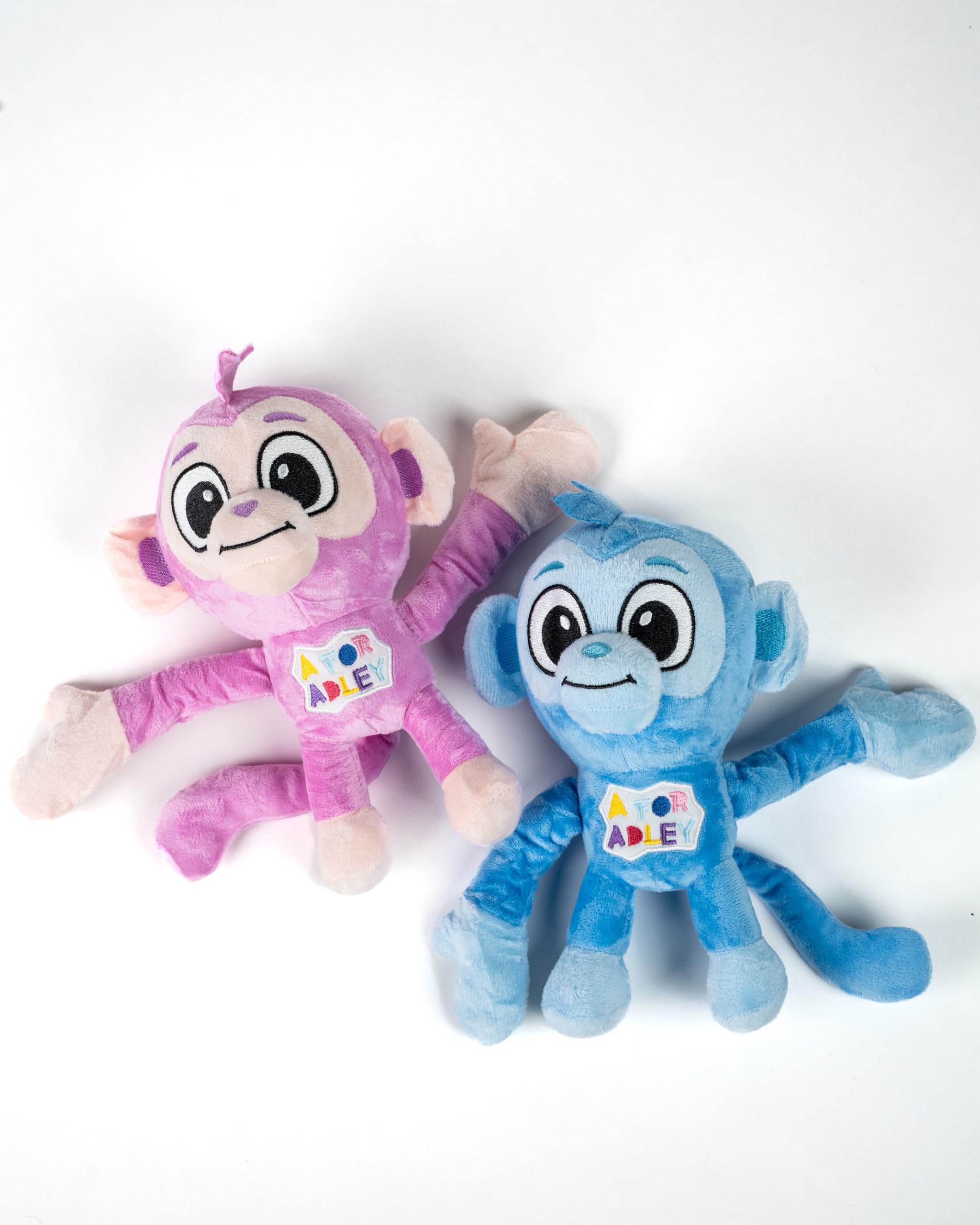 A FOR ADLEY Official Merch Monkey Buddies, A Pink and Blue Monkey Ready to Be Your Favorite Stuffed Animal Friend. Comes with Carrying Bag.