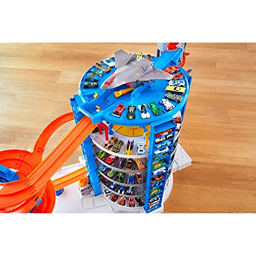 Hot Wheels Toy Car Track Set & 4 1:64 Scale Cars, Super Ultimate Garage, 3+ Ft Tall with Motorized Gorilla & Storage for 140 Cars