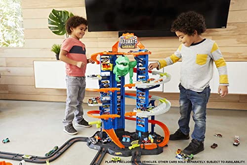Hot Wheels Toy Car Track Set City Ultimate Garage Moving T-Rex Dinosaur, 100+ 1:64 Scale Vehicle Storage, 3-Ft Tall, 2 Toy Cars