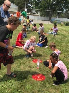 BOTTLE-BULLSEYE™ Game. Official Game Kit. Fun Family Game. Play Indoors or Outdoors. Made in The USA. Great for Family Game Night, Parties, picnics, Camping, Tailgating. Durable Target & Bottles!