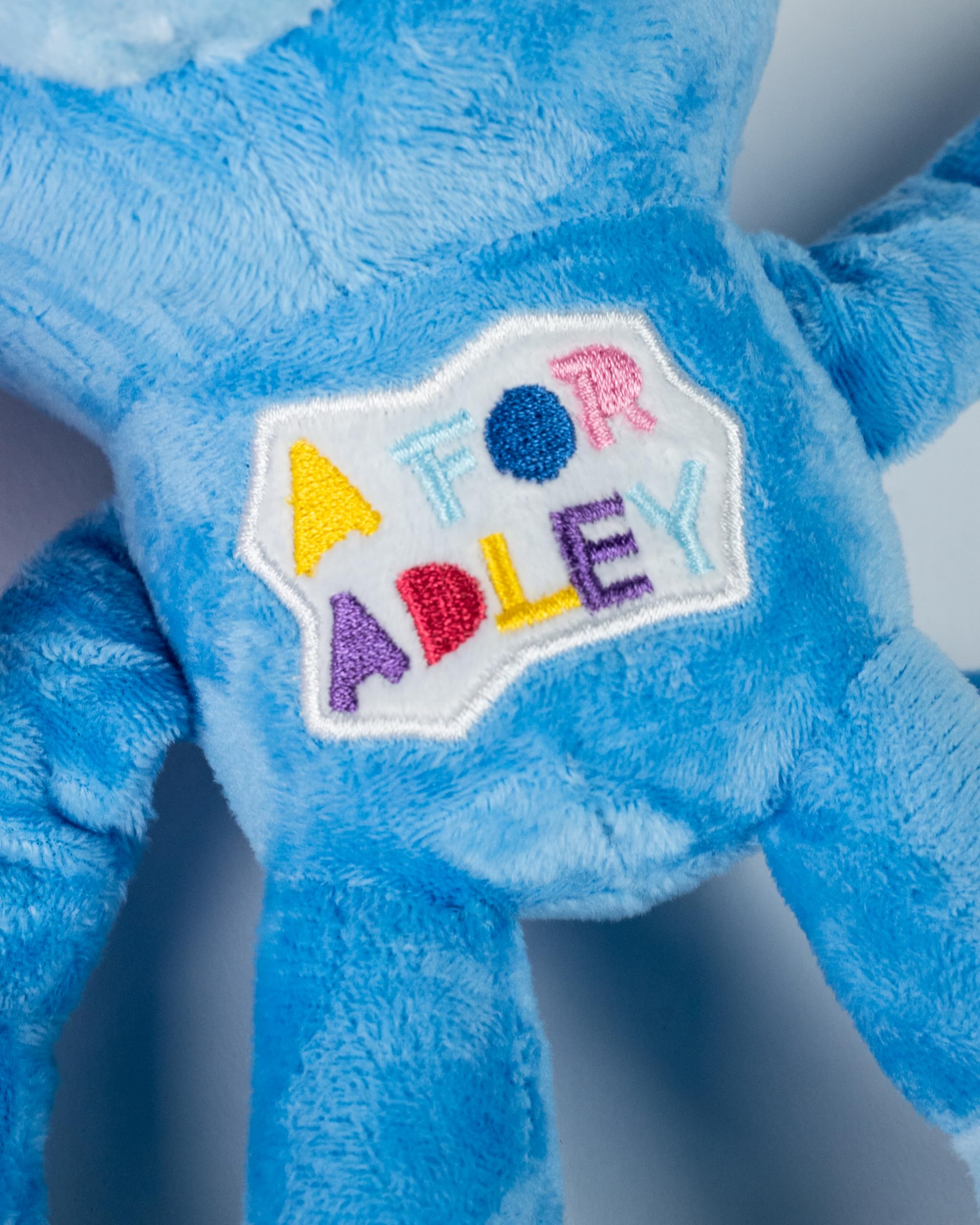 A FOR ADLEY Official Merch Monkey Buddies, A Pink and Blue Monkey Ready to Be Your Favorite Stuffed Animal Friend. Comes with Carrying Bag.