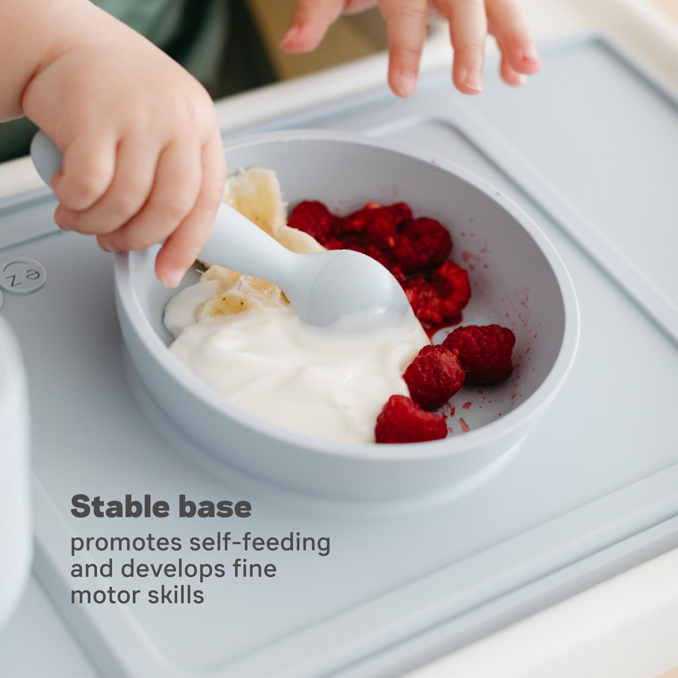ezpz Mini Bowl for 12 Months+ (Lime) - 100% Silicone Suction Bowl with Built-in Placemat for Toddlers - Comes with a Reusable Travel Bag