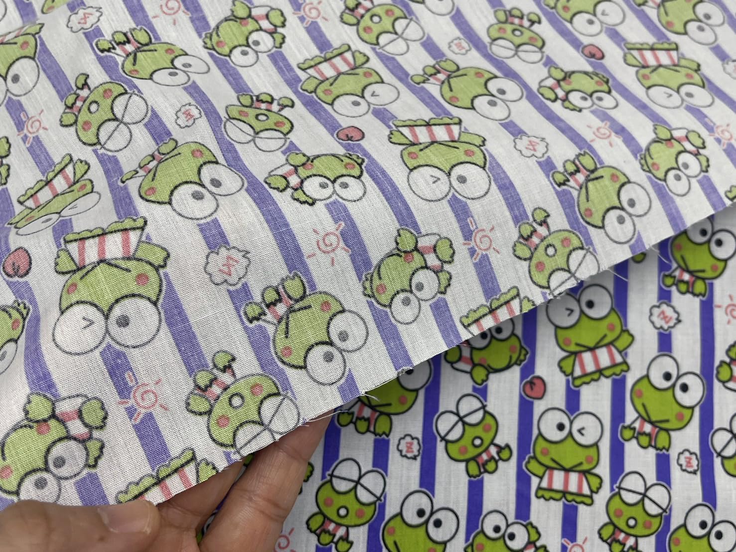 AMORNPHAN 44 Inch Green Keroro Happy Frog Cartoon Purple Stripes Printed On White Cotton Fabric Themed Pattern with Frogs for Craft Decorative Kid Patchwork Handmade Sewing Crafting for 1 Yard