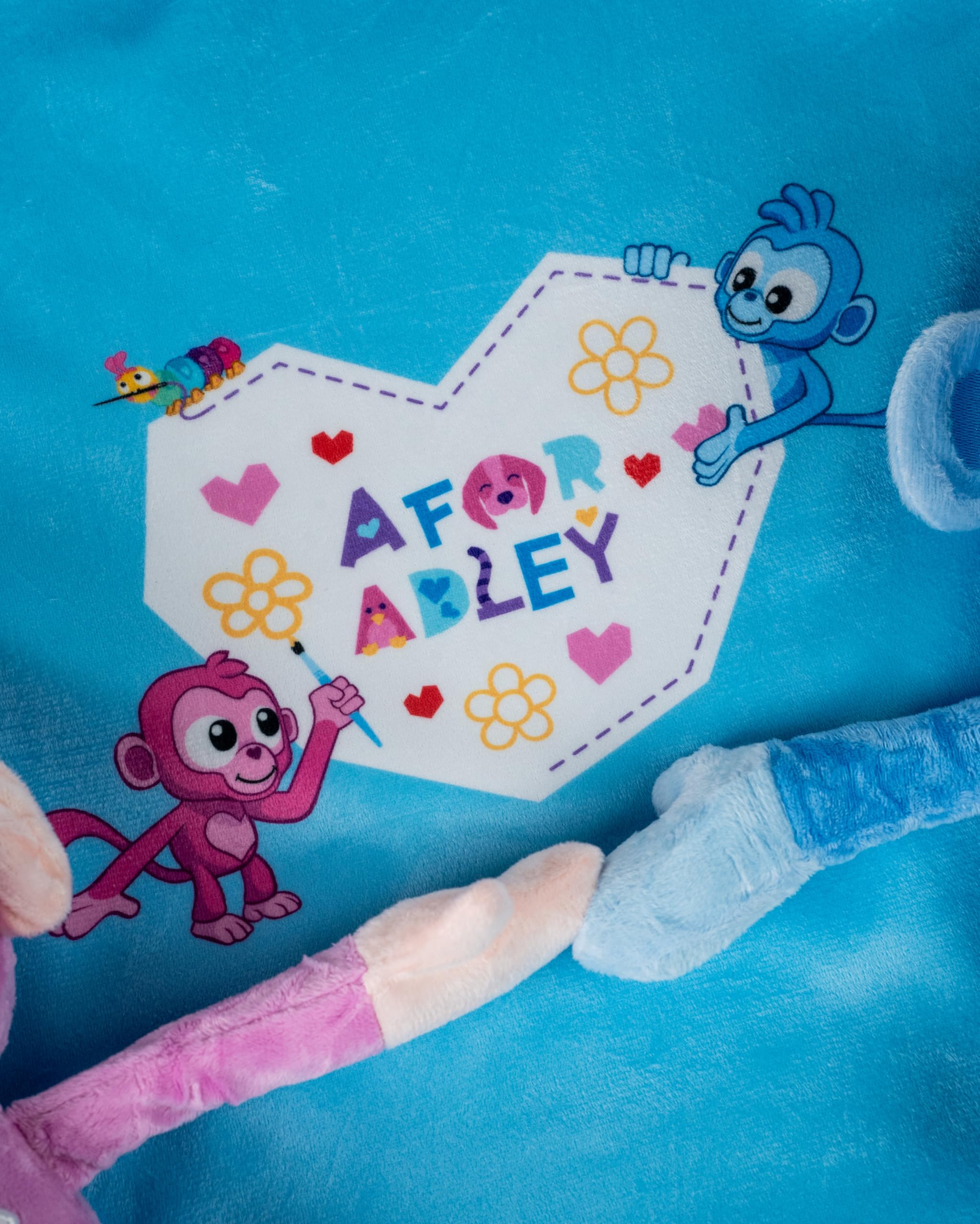 A FOR ADLEY Official Merch Monkey Buddies, A Pink and Blue Monkey Ready to Be Your Favorite Stuffed Animal Friend. Comes with Carrying Bag.