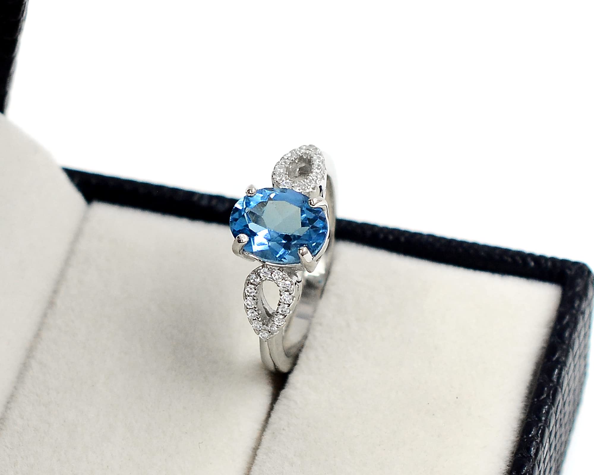 925 Sterling Silver Natural 9X7 MM Oval Cut Swiss Blue Topaz December Birthstone Solitaire Unisex Proposal Engagement Ring Wedding Jewelry Gift For Her (Rhodium Plated Silver, 7.5)