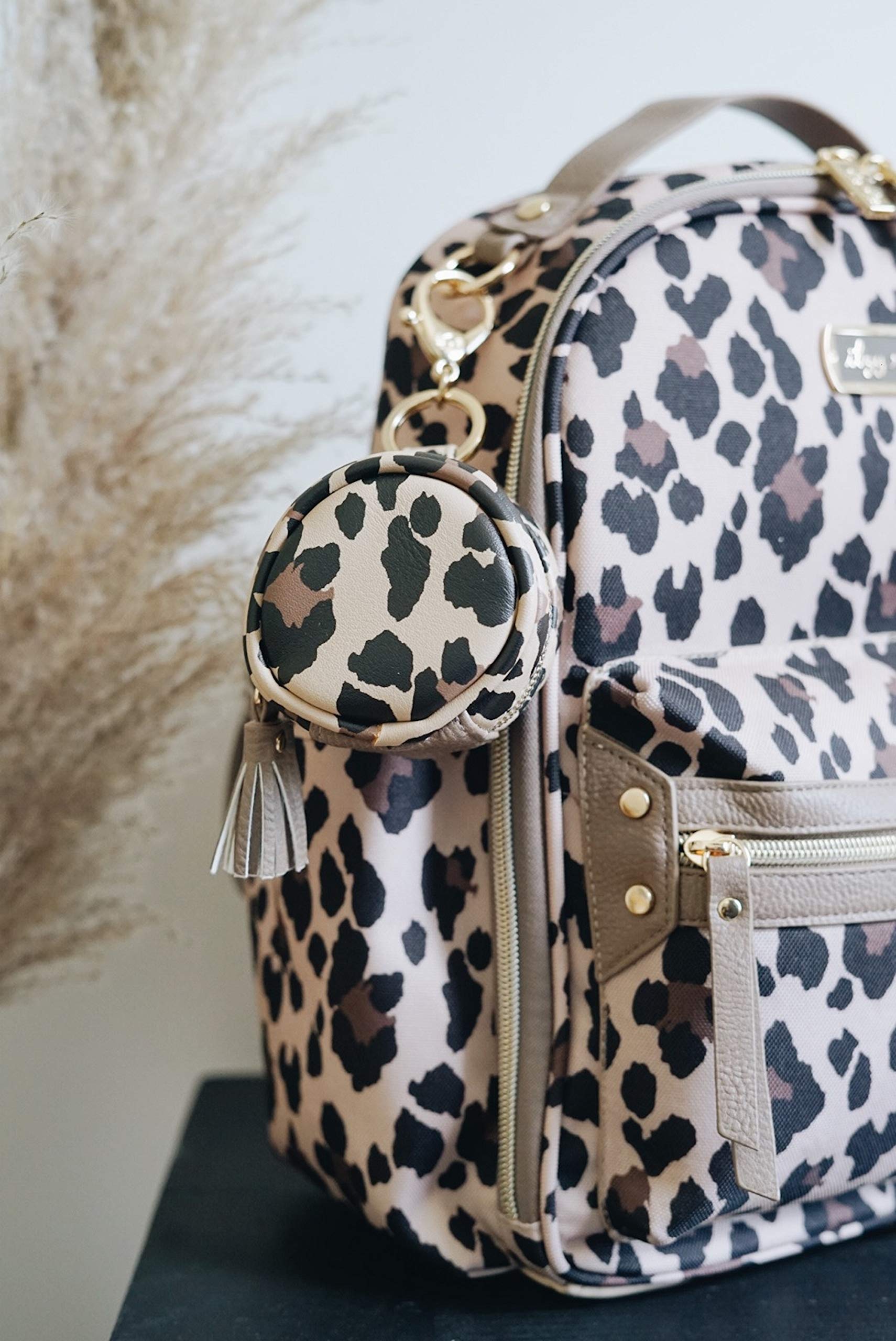 Itzy Ritzy Pacifier Holder Case with Clip - Pacifier Case Includes Clasp to Easily Attach to a Diaper Bag or Purse, Measures 2.5" in Diameter and Holds 2 Pacifiers (Leopard)