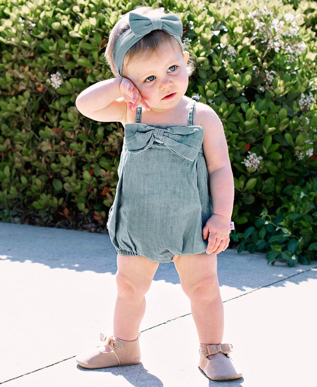 RuffleButts® Baby/Toddler Girls Light Wash Denim Bow-Front Bubble Romper - 3-6m