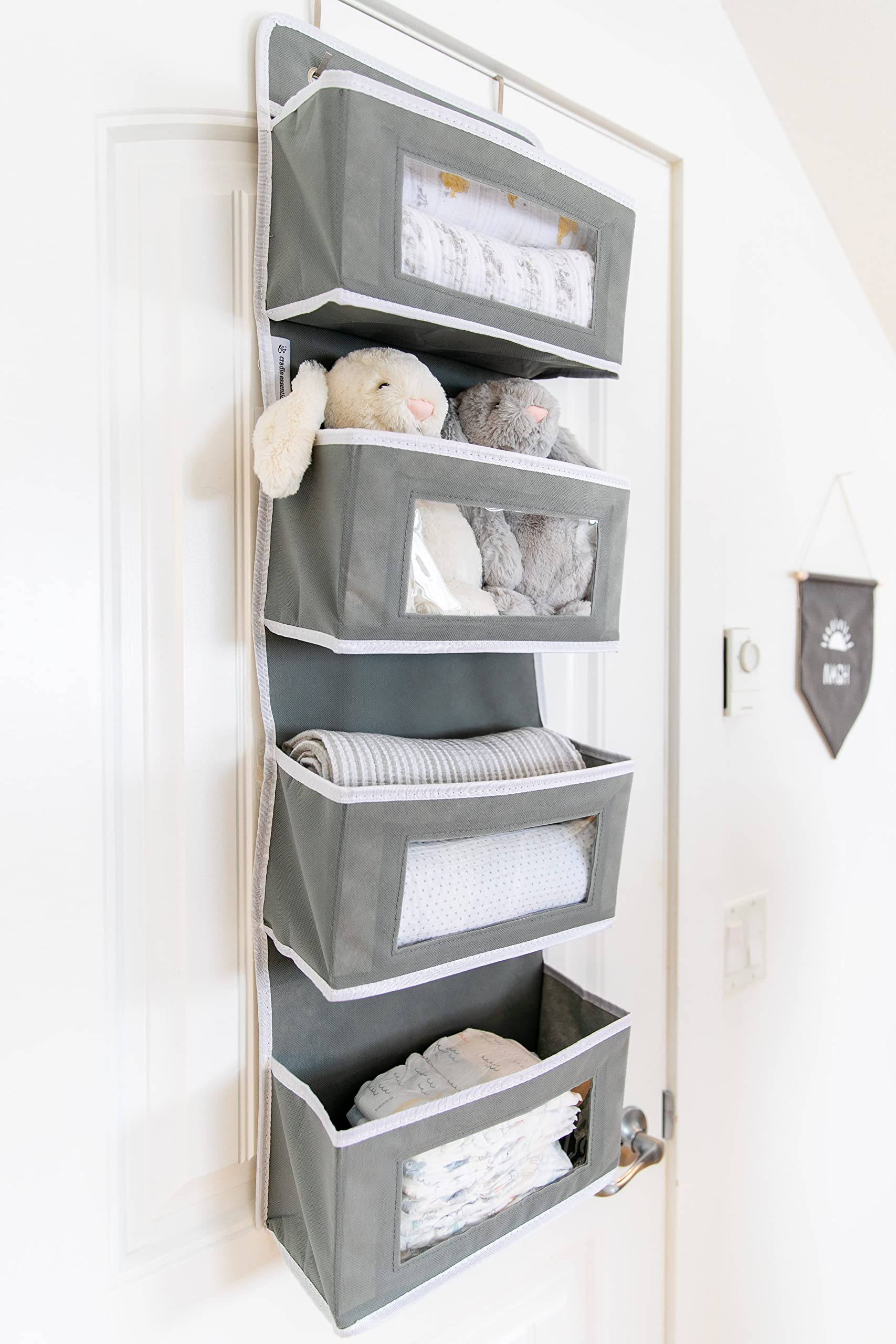 Cradle Essentials Over Door Hanging Organizer | Storage Caddy for Newborn and Baby Items, Stuffed Animals | Large Pockets with Clear Windows for Nursery, Mudroom, Bathroom, Laundry, Pantry, Closet